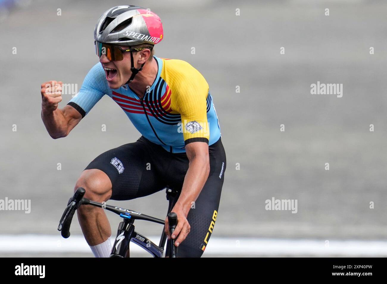 Remco Evenepoel, of Belgium, celebrates winning the men's road cycling ...