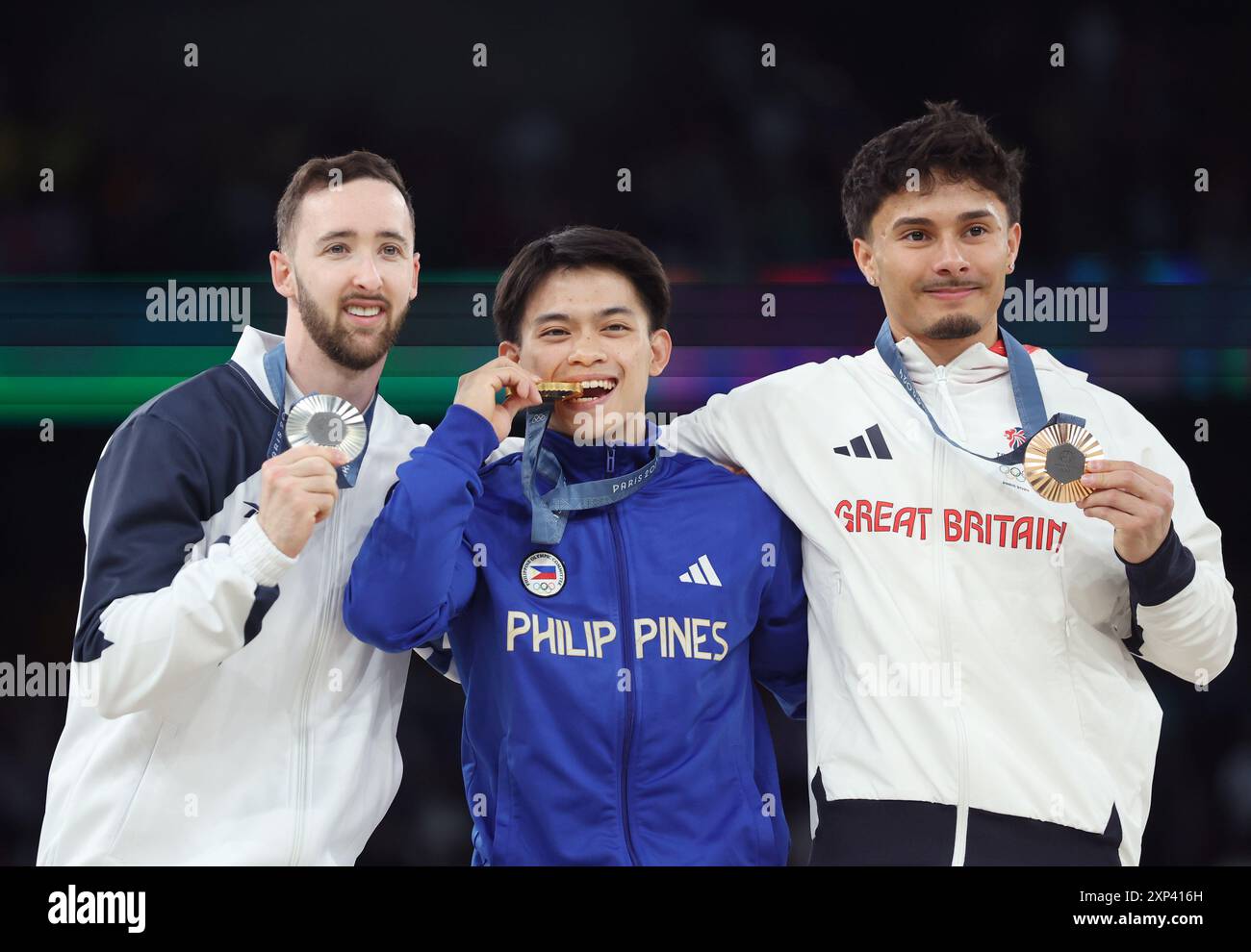 Paris, France. 3rd Aug, 2024. Gold medalist Carlos Edriel Yulo (C) of ...