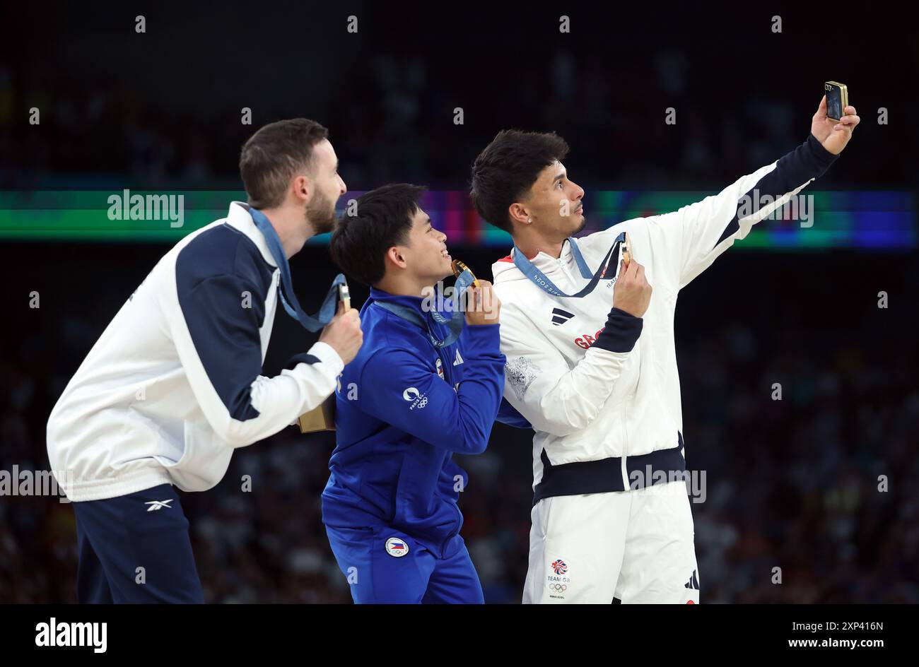 Paris, France. 3rd Aug, 2024. Gold medalist Carlos Edriel Yulo (C) of ...