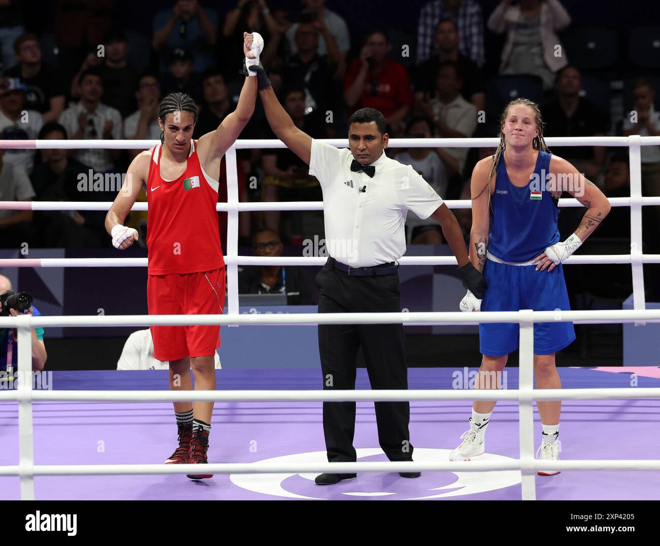 Algeria's Imane Khelif (left) following her victory over Hungary's Luca ...