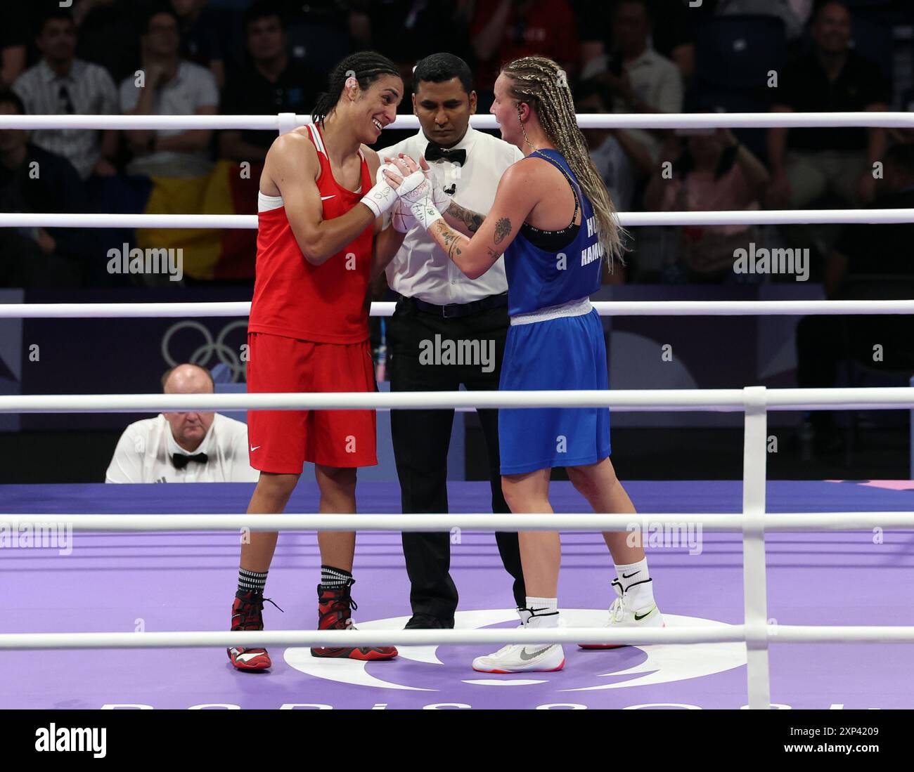 Algeria's Imane Khelif (left) following her victory over Hungary's Luca ...