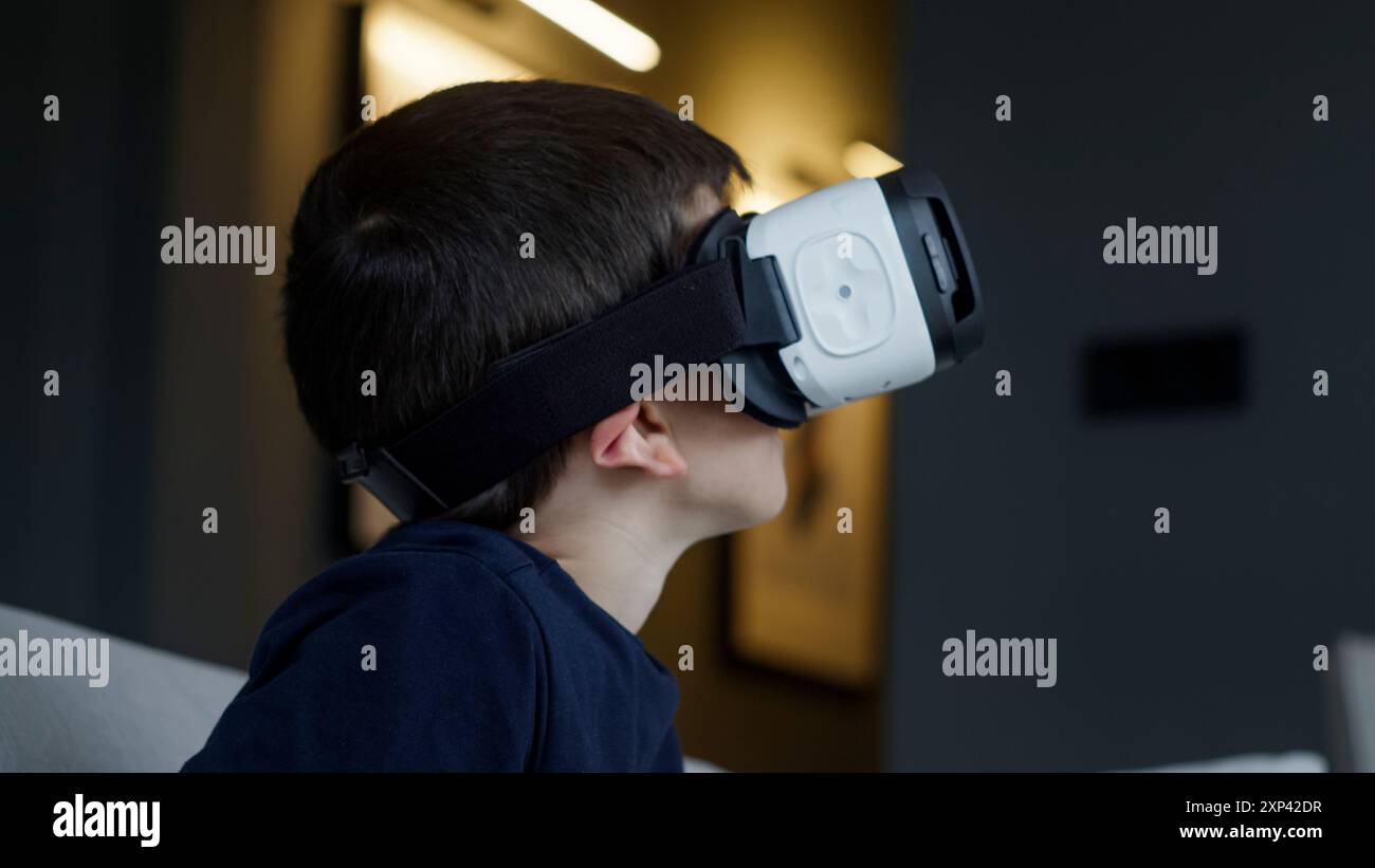 Child wearing VR headset, delving into virtual reality. The wonder and excitement of modern ...