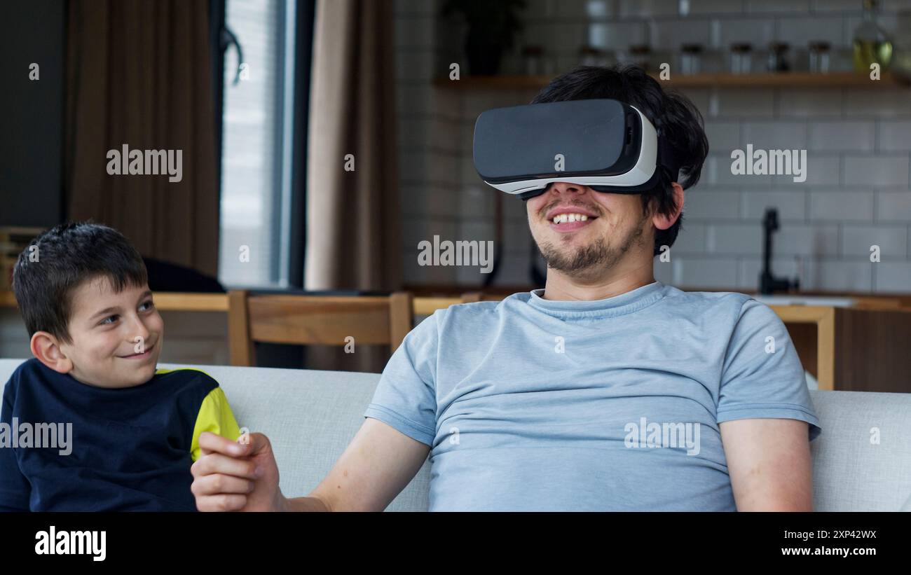 Bonding over tech hi-res stock photography and images - Alamy