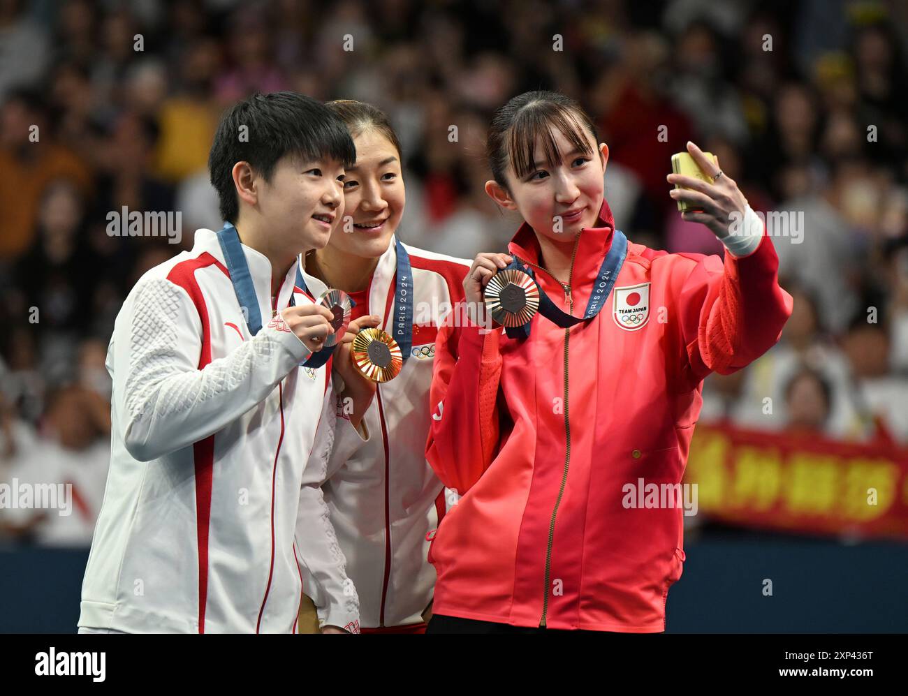 (L-R) SUN Yingsha of China, silver; CHEN Meng of China, gold; and ...