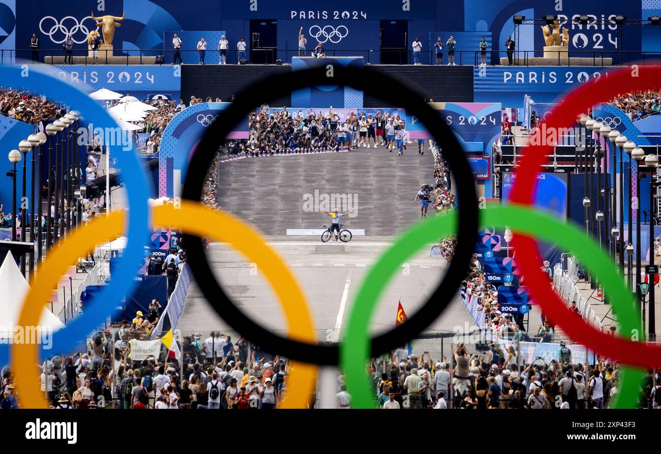 PARIS - Belgian cyclist Remco Evenepoel crosses the finish line of the ...