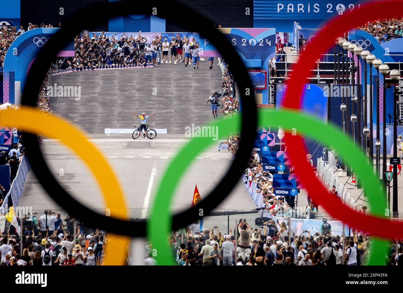 PARIS - Belgian cyclist Remco Evenepoel crosses the finish line of the ...