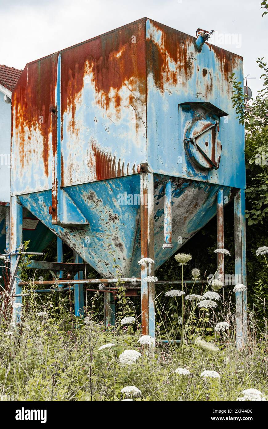 Abandoned, rusty metal silos. Grain storage. Bulk material container ...