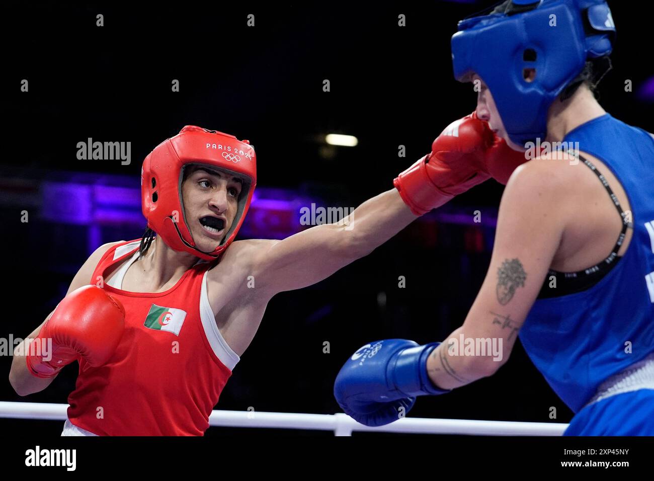 Algeria's Imane Khelif, left, fights Hungary's Anna Hamori in their ...