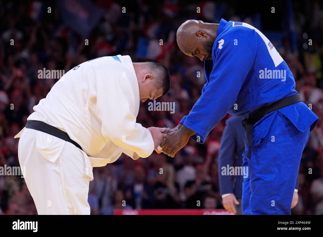 Japan's Tatsuru Saito and France's Teddy Riner shake hands after men's ...