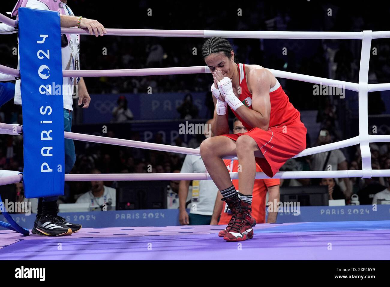 Algeria's Imane Khelif reacts after defeating Hungary's Anna Hamori in ...