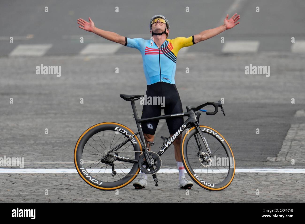 Remco Evenepoel, of Belgium, celebrates winning the men's road cycling ...