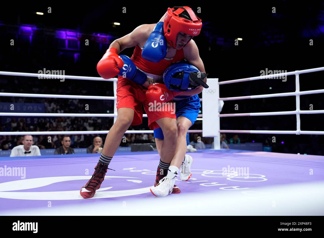 Algeria's Imane Khelif, left, and Hungary's Anna Hamori fall to the mat ...