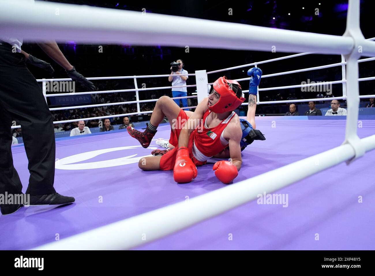 Algeria's Imane Khelif, left, and Hungary's Anna Hamori fall to the mat ...