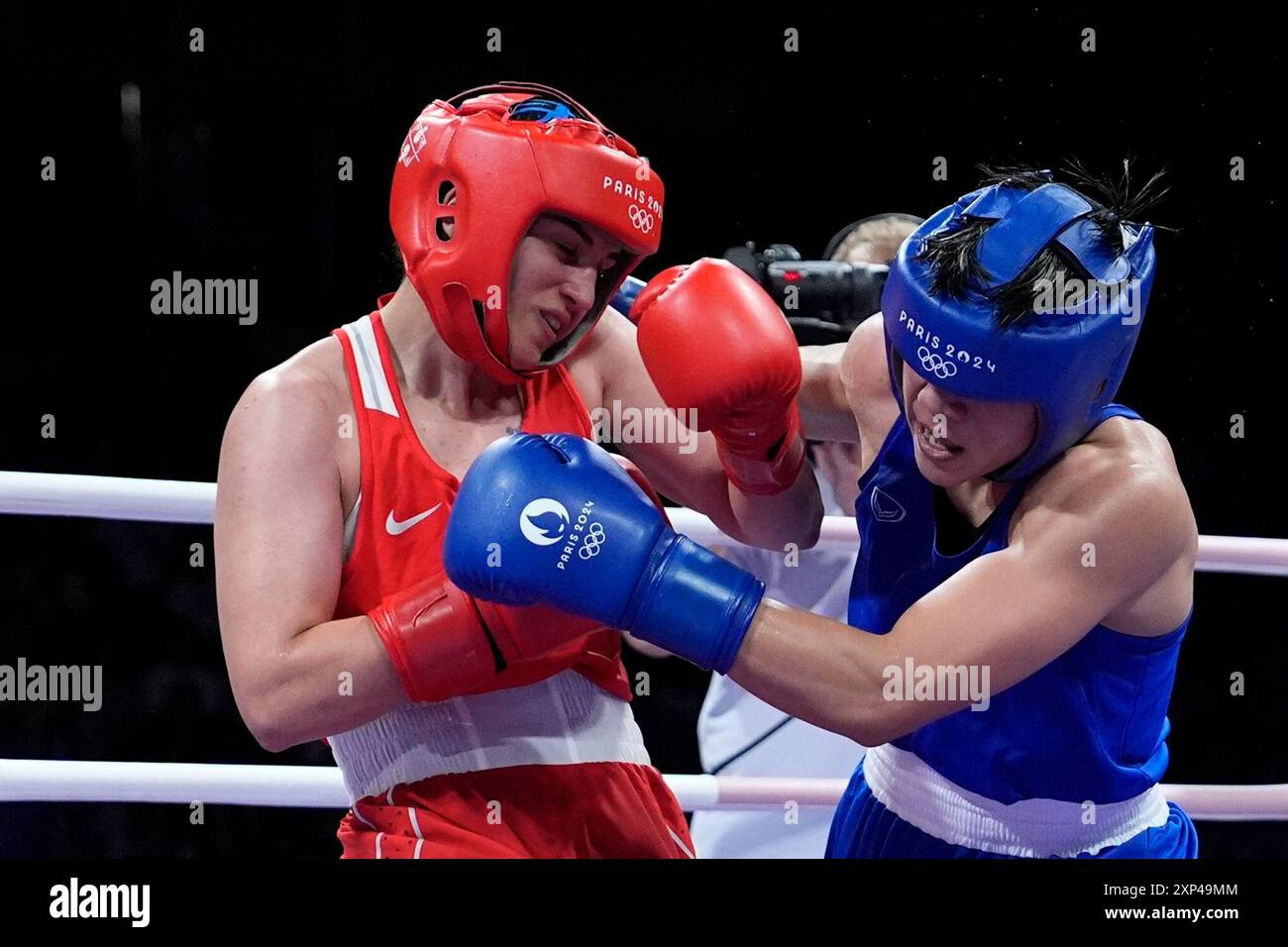 Turkey's Busenaz Surmeneli, left, fights Thailand's Janjaem ...