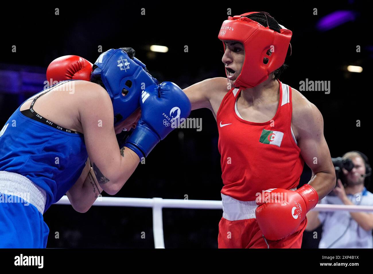 Algeria's Imane Khelif hits Hungary's Anna Hamori in their women's 66kg ...