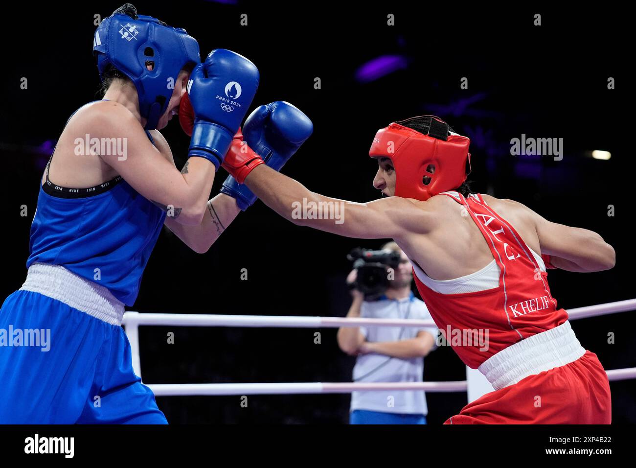 Algeria's Imane Khelif hits Hungary's Anna Hamori in their women's 66kg ...