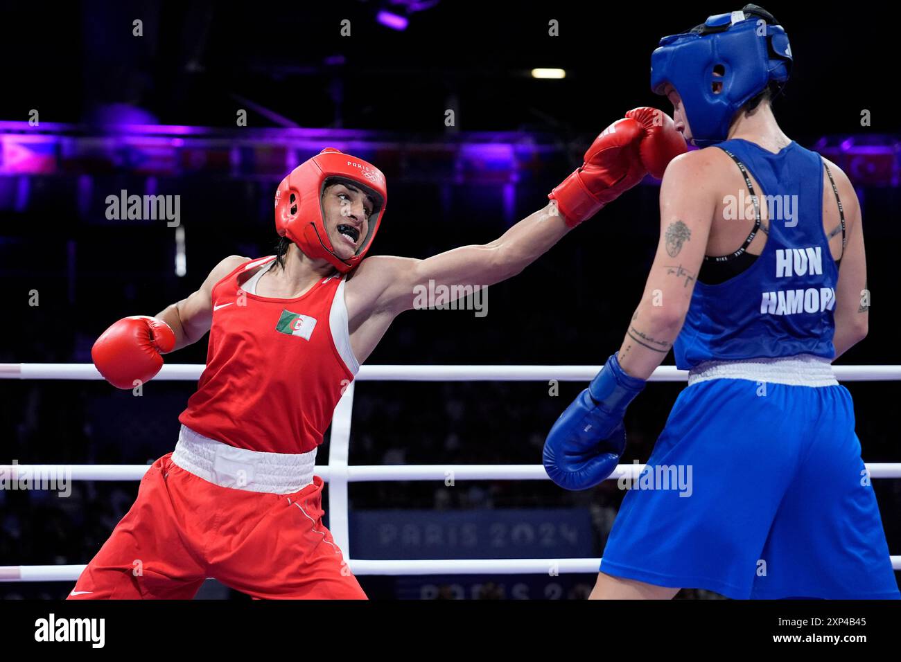 Algeria's Imane Khelif hits Hungary's Anna Hamori in their women's 66kg ...