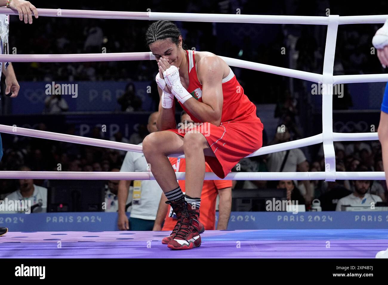 Algeria's Imane Khelif reacts after defeating Hungary's Anna Hamori in ...
