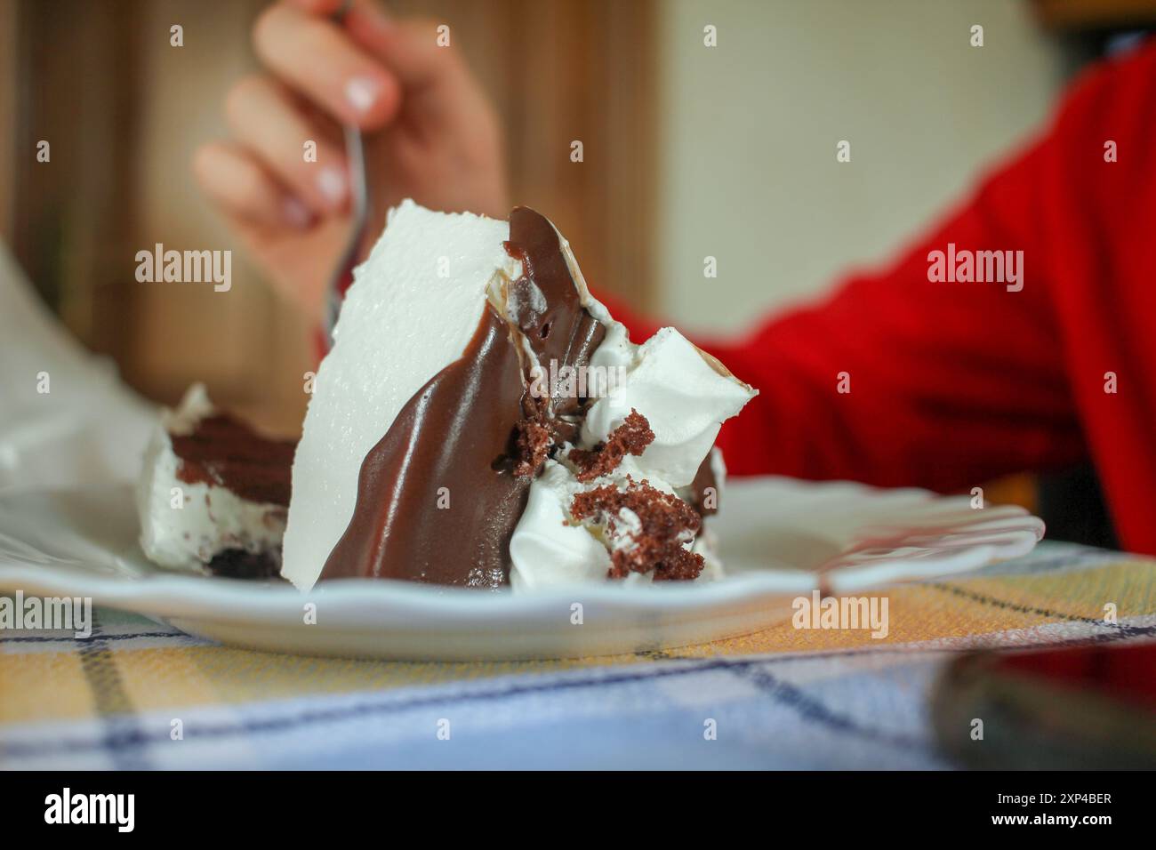 a kid eating a cake with chocolate for dessert at home Stock Photo - Alamy