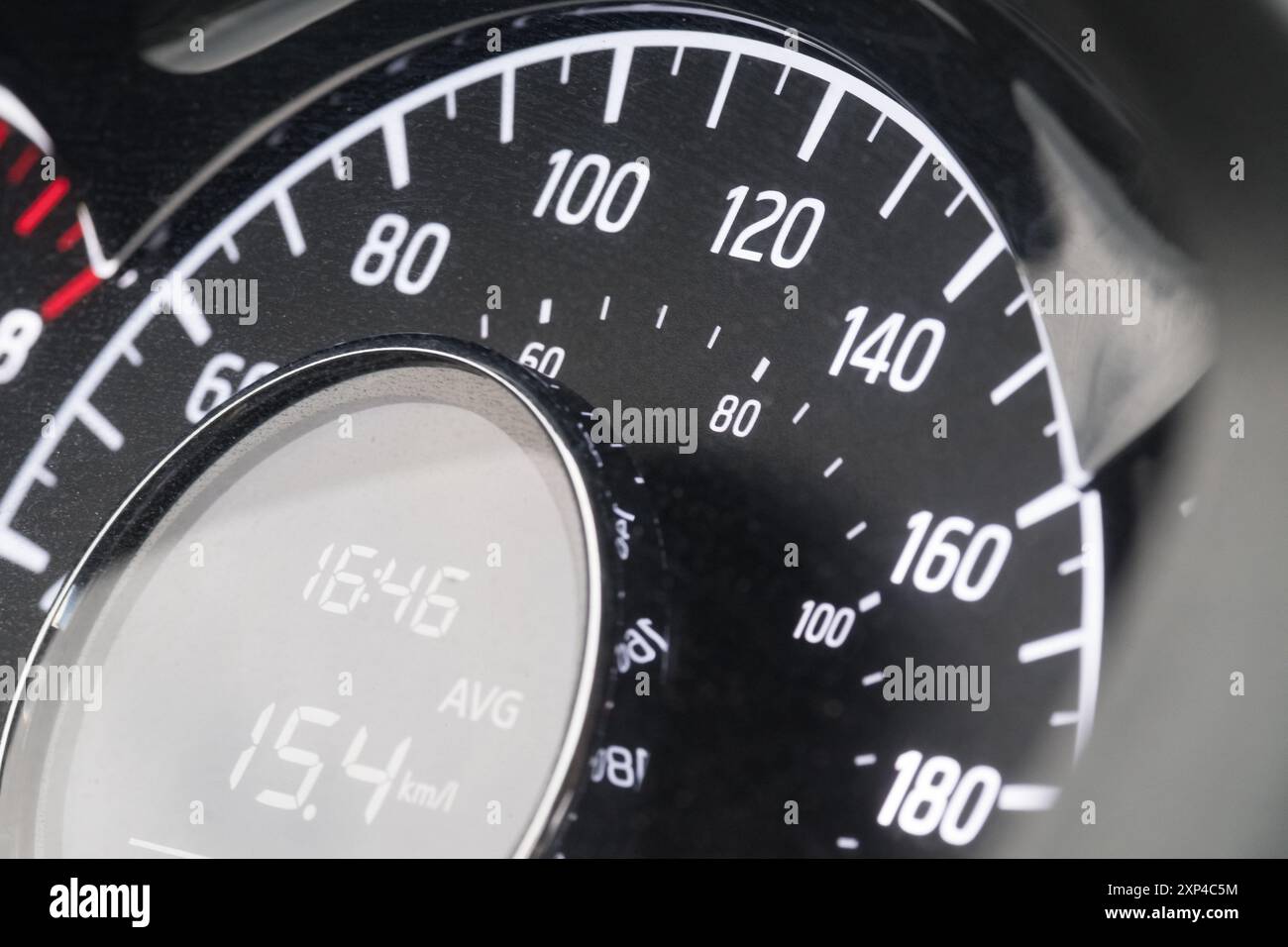 Close-up of car speedometer with digital display showing average speed ...