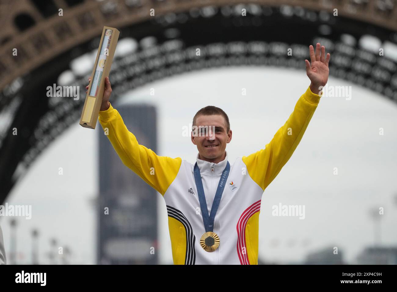 Remco Evenepoel, of Belgium, poses with the gold medal of the men's ...