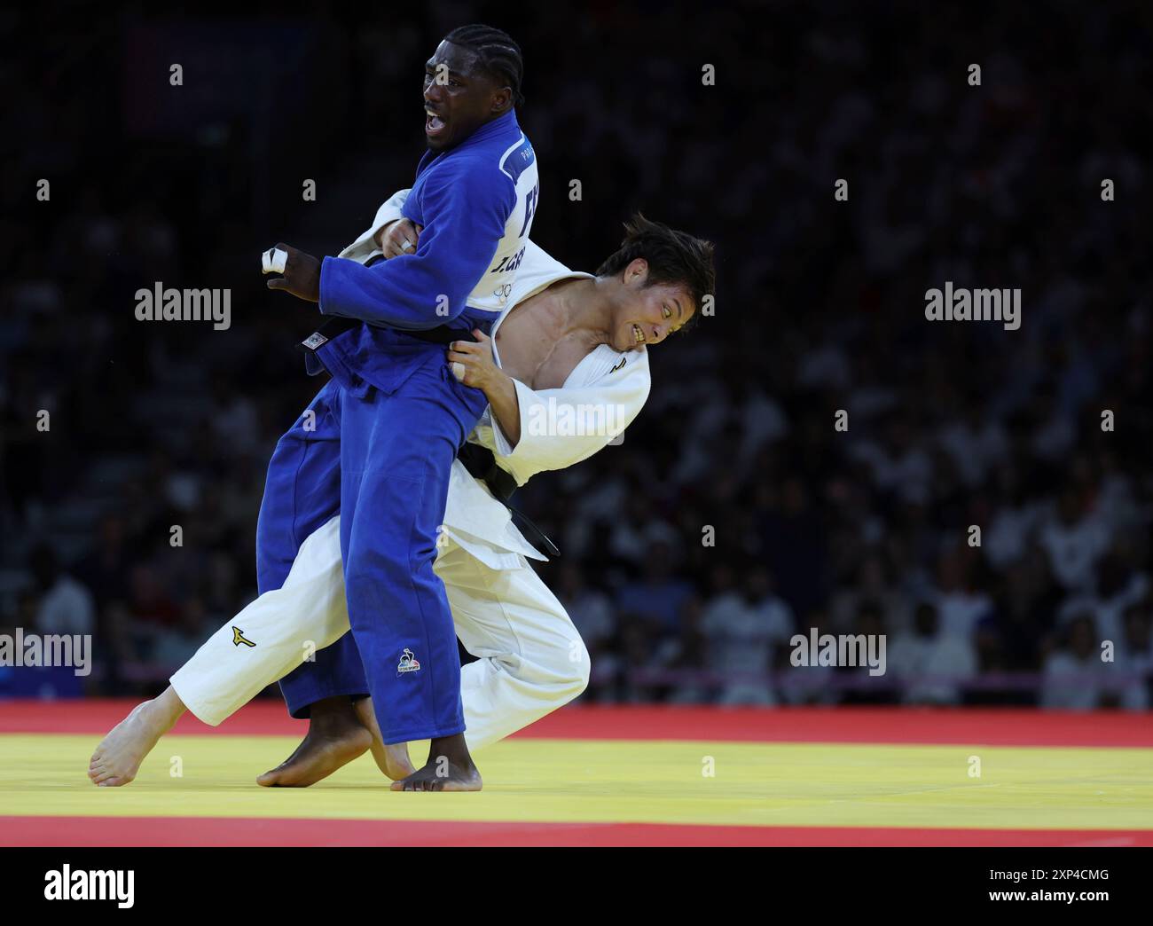 GABA Joan-Benjamin of France (blue) and ABE Hifumi of Japan compete in ...