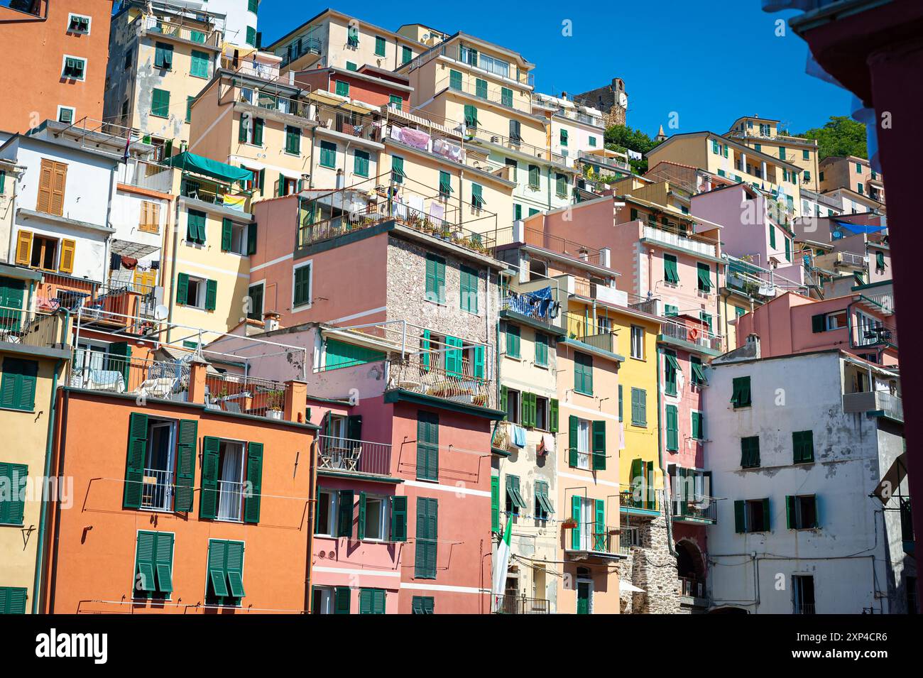 Traditional colored italian houses on a cliff in the village of ...