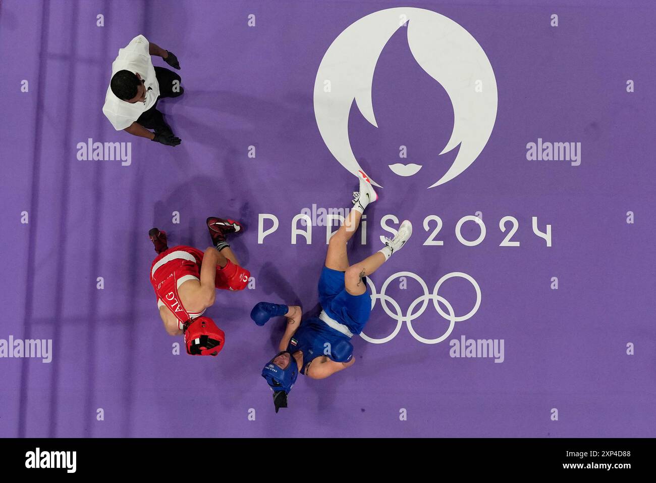 Hungary's Anna Hamori, right, falls to the mat against Algeria's Imane ...