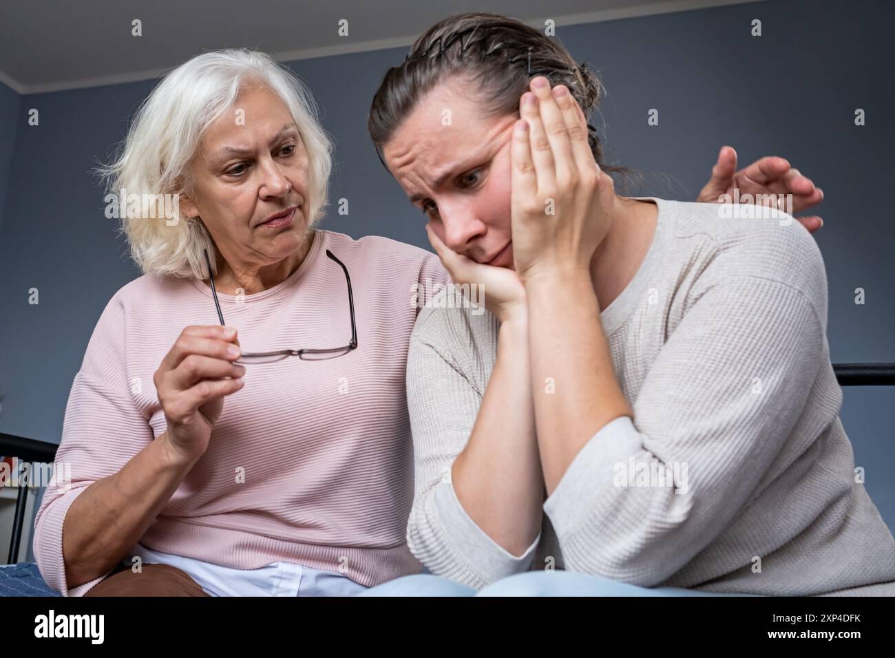 Aged mom encourage beloved adult girl child in difficult life situation ...