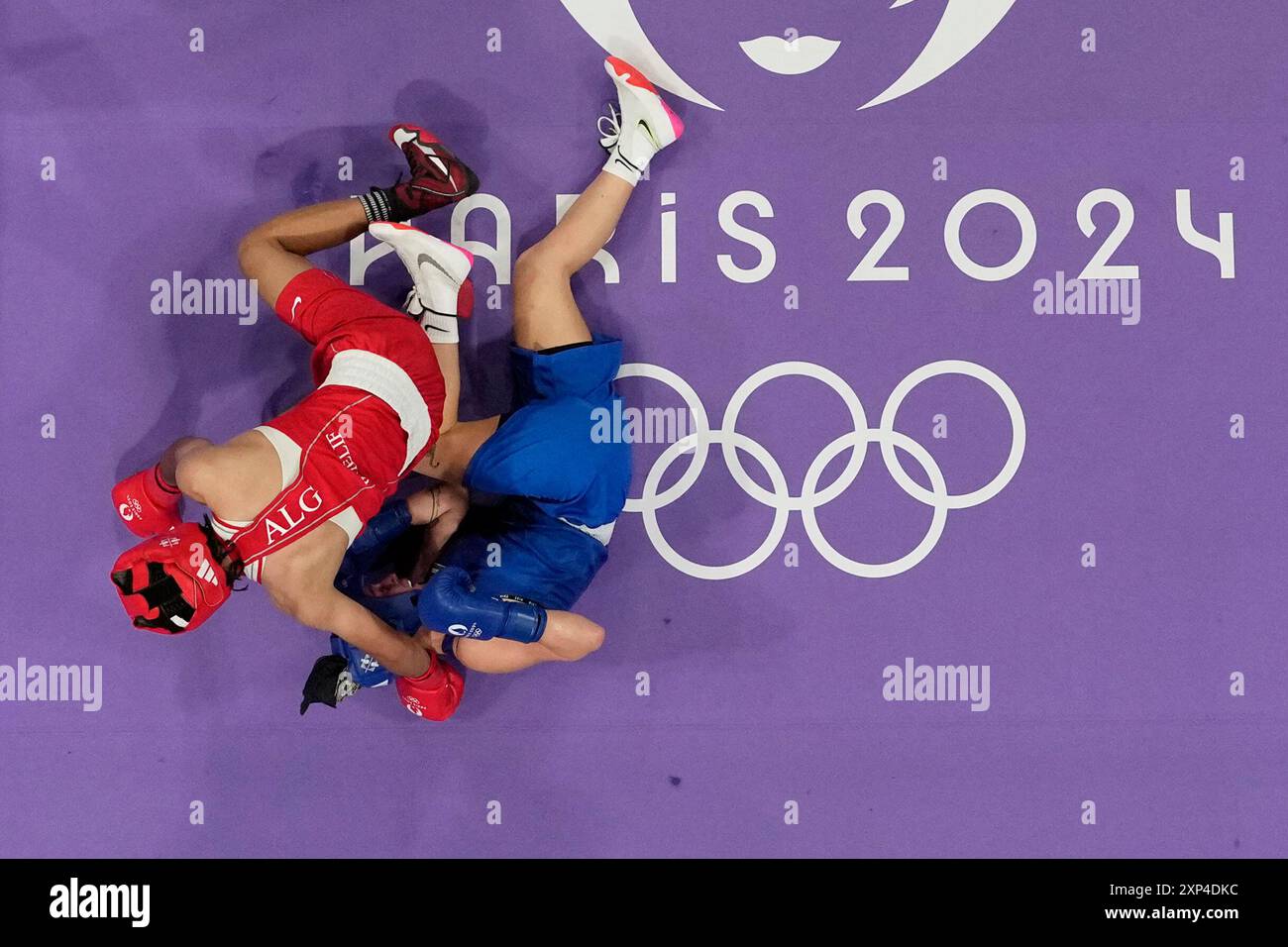 Hungary's Anna Hamori, right, and Algeria's Imane Khelif fall to the ...