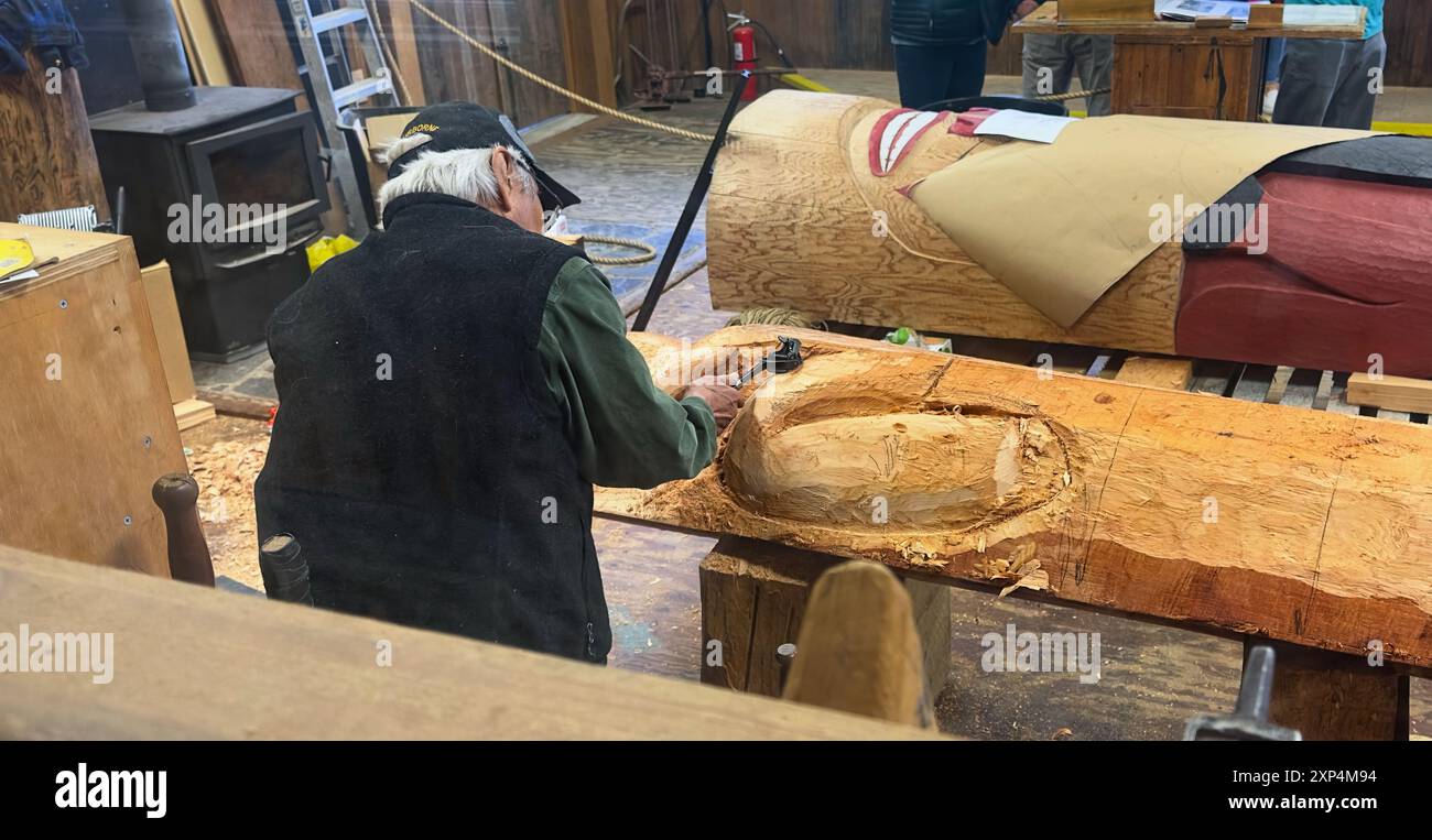 A master carver at work on a new totem pole at Saxman Totem Park in the workshop, which is open ...