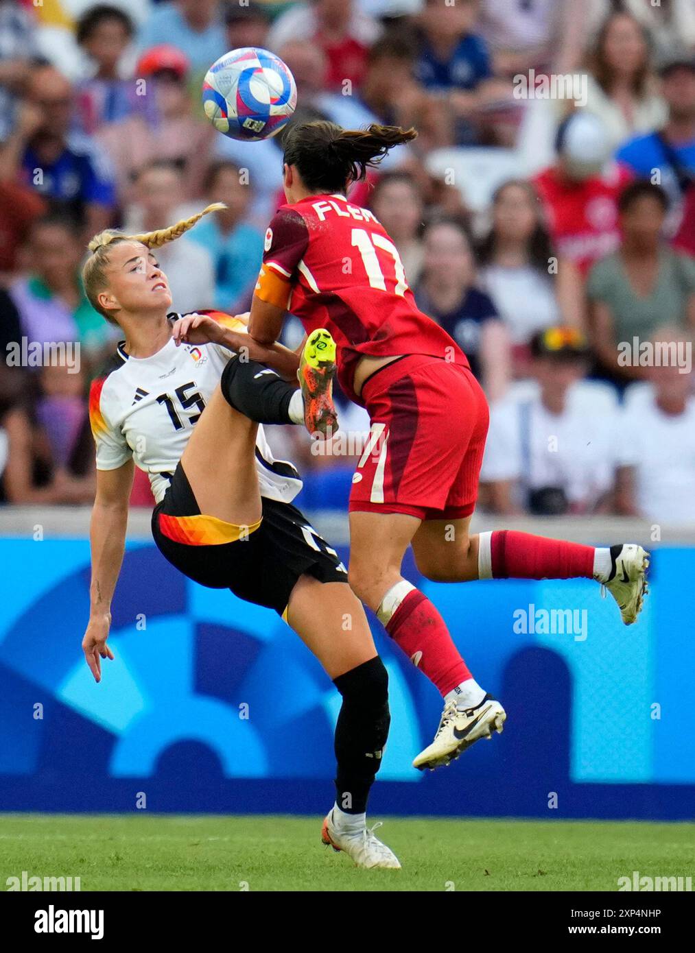 Germany's Giulia Gwinn fights for the ball with Canada's Jessie Fleming ...