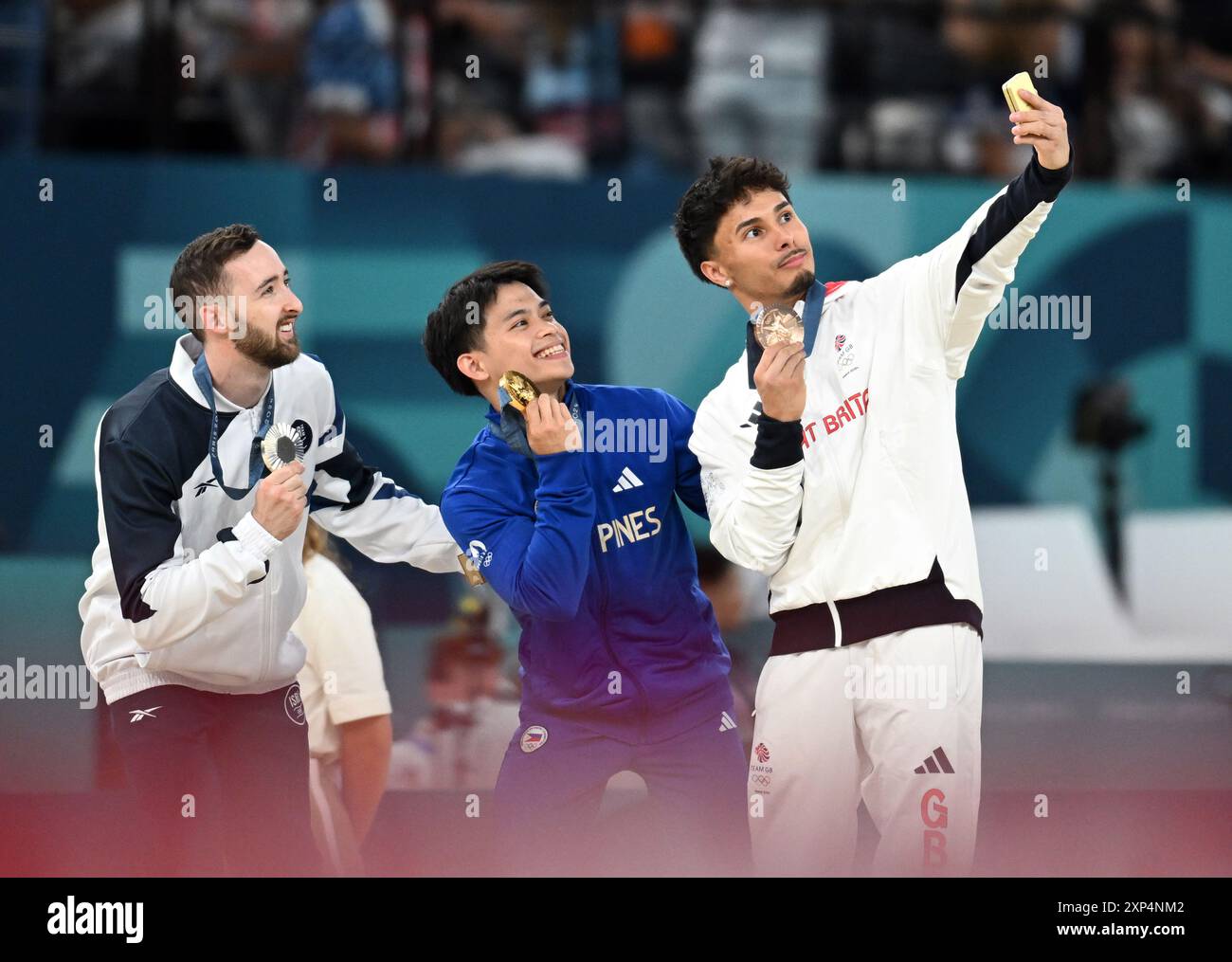 Paris, France. 3rd Aug, 2024. Gold medalist Carlos Edriel Yulo (C) of ...