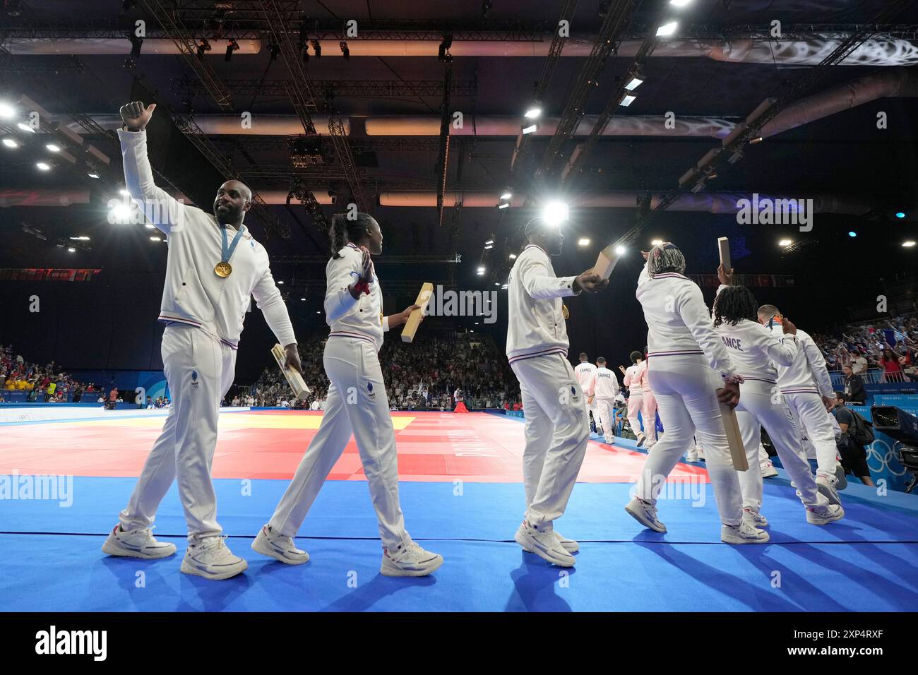 Team of France walk out from the competition floor after the award ...