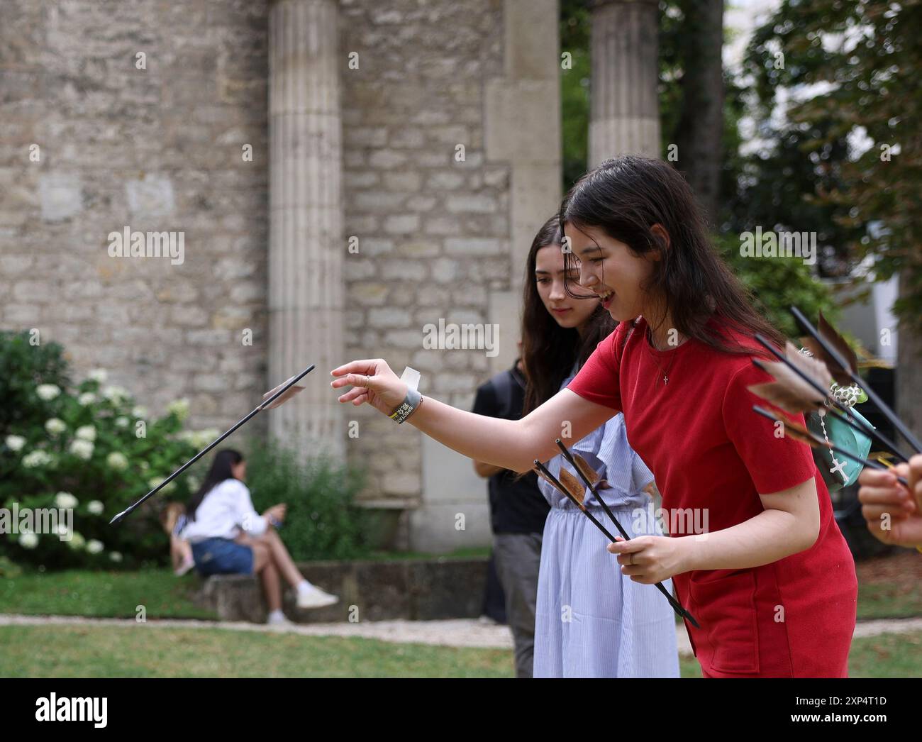 Paris, France. 3rd Aug, 2024. A child experiences Touhu game, or pitch ...