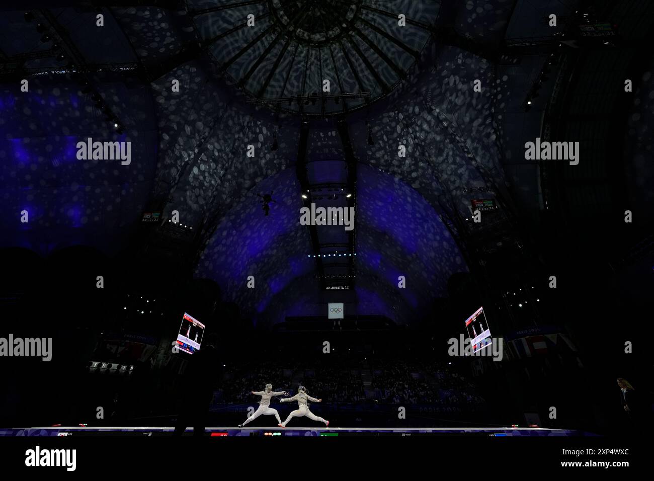 South Korea's Choi Sebin, left, competes with Ukraine's Yuliia ...