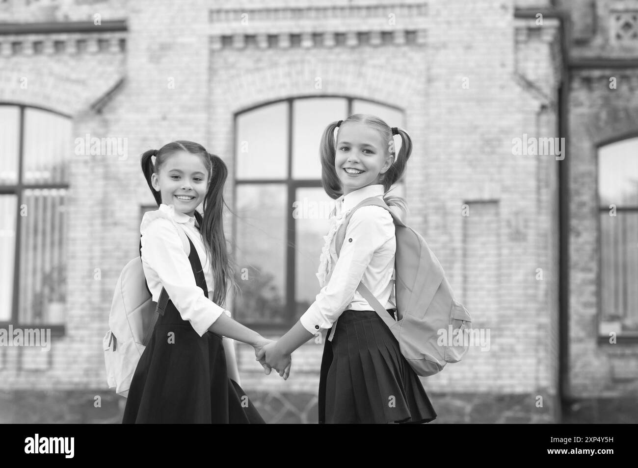 cheerful two school girls best friends together outdoor Stock Photo - Alamy