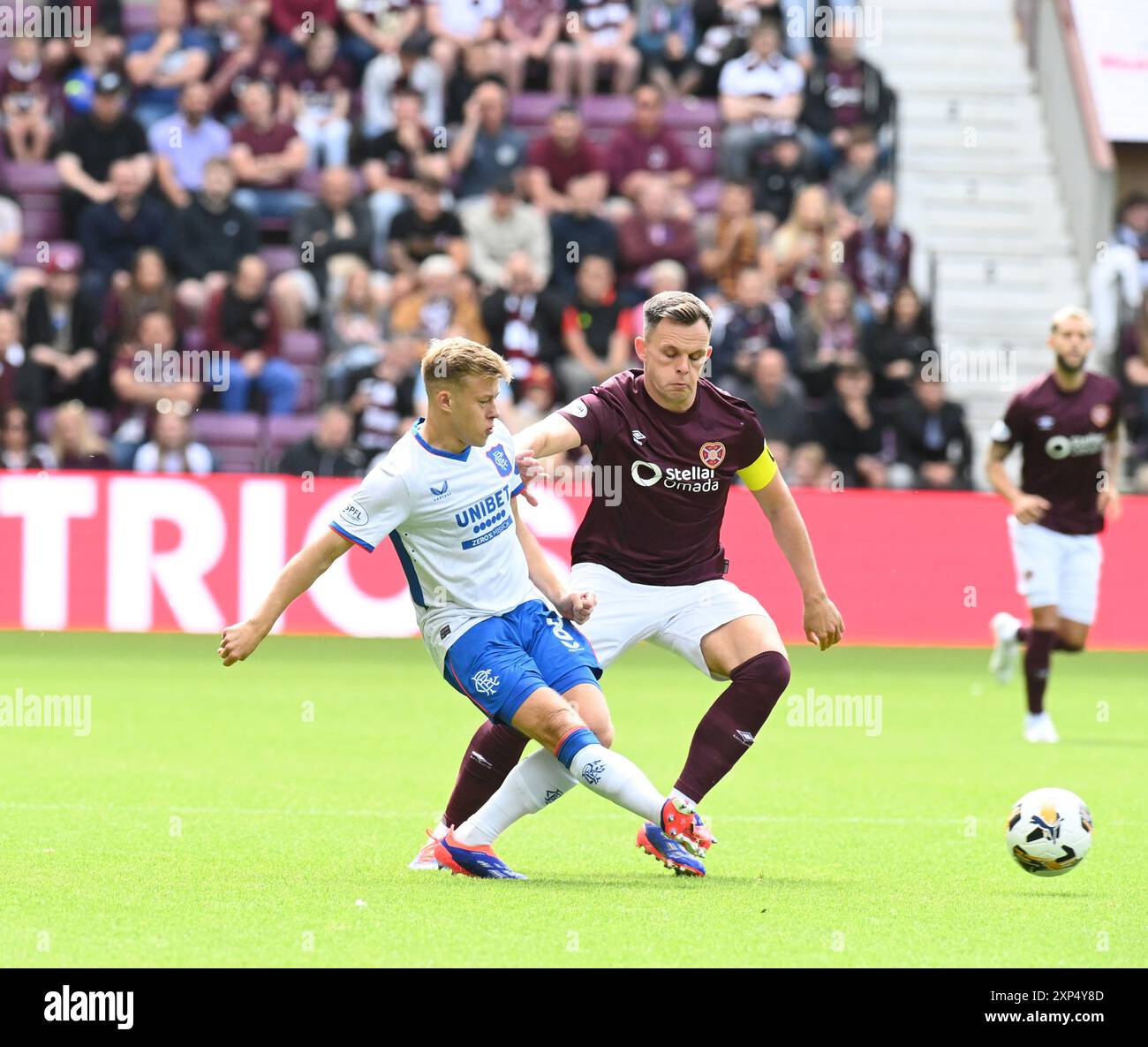 Connor barron of rangers clears from lawrence shankland of hearts hi ...
