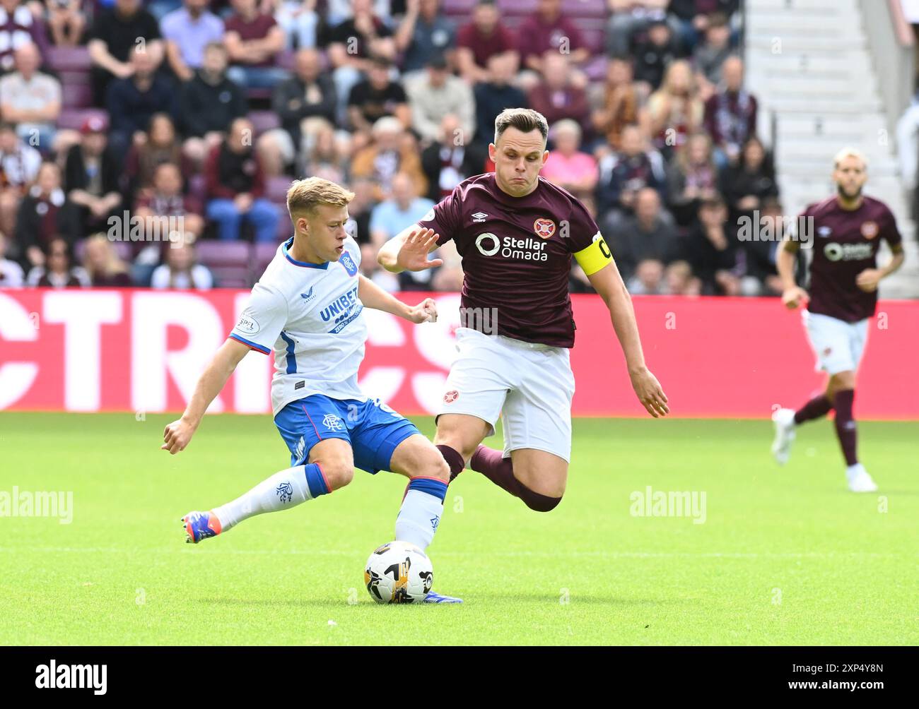 Connor barron of rangers clears from lawrence shankland of hearts hi ...