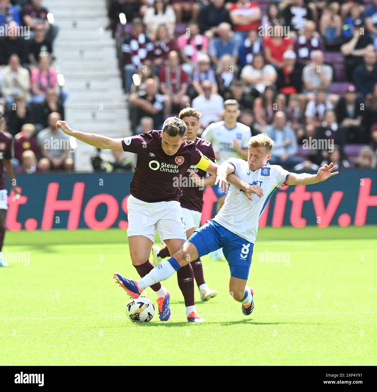 Lawrence shankland of hearts holds off connor barron of rangers hi-res ...
