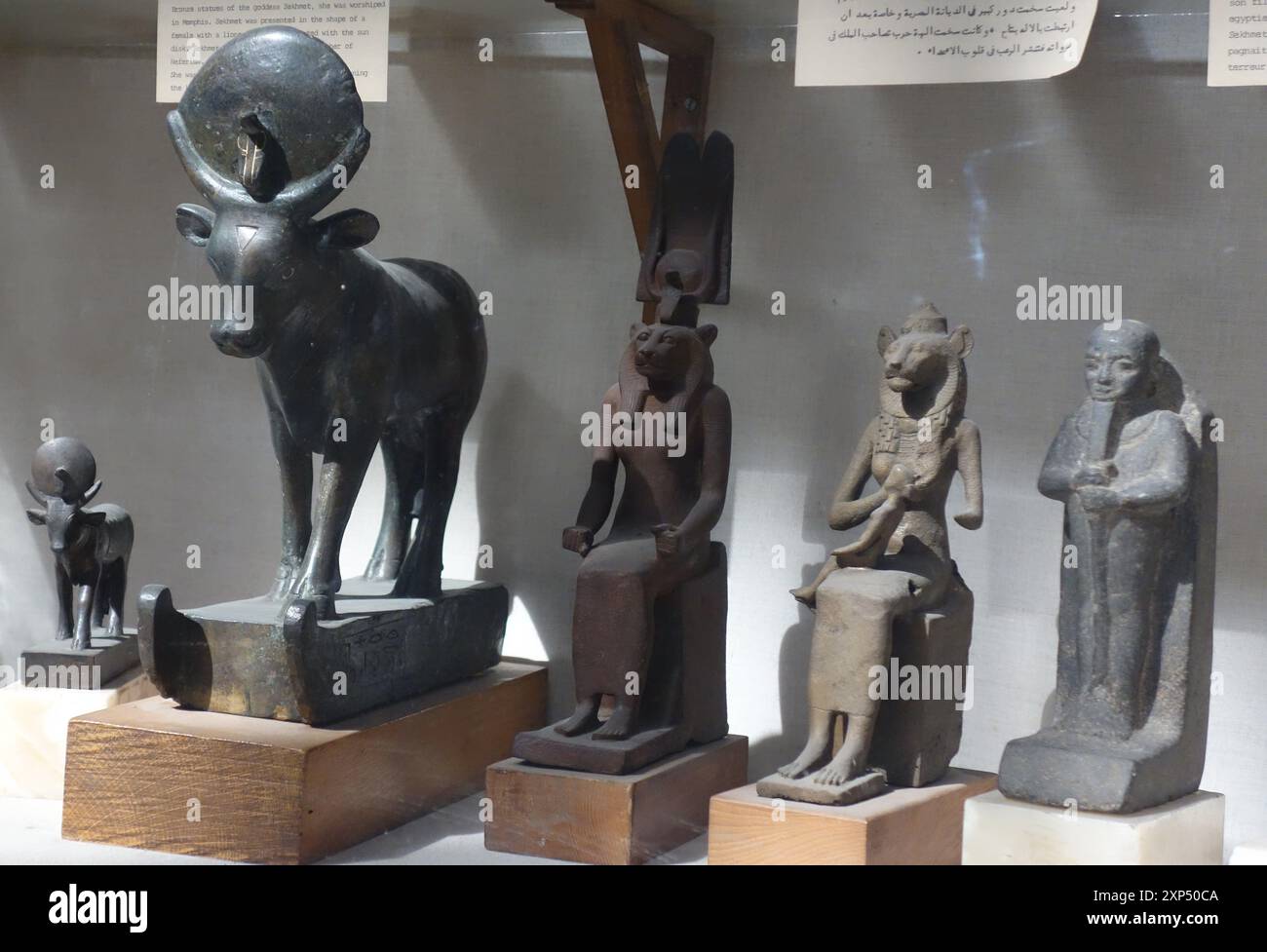 Two statues of the God Ptah, Statue of Apis and the woman with the ...