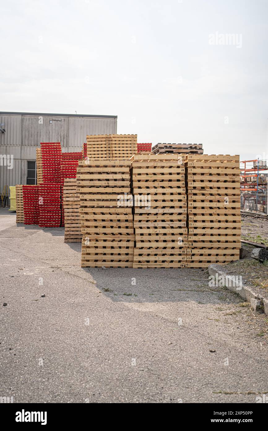Stacks of wood pallets in a factory Stock Photo - Alamy