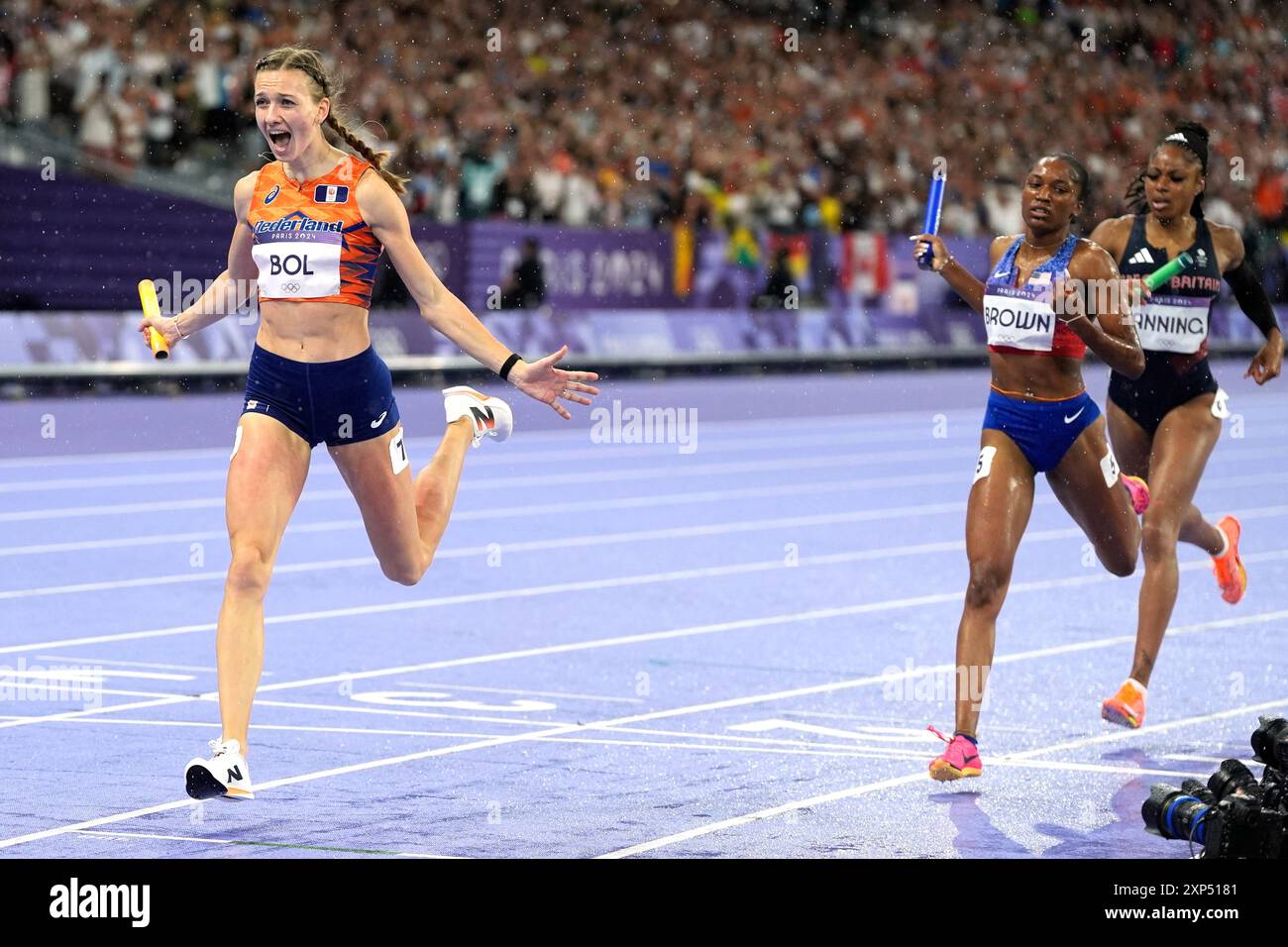 Femke Bol, of the Netherlands, reacts as she crosses the finish line to win the 4x400-meter ...