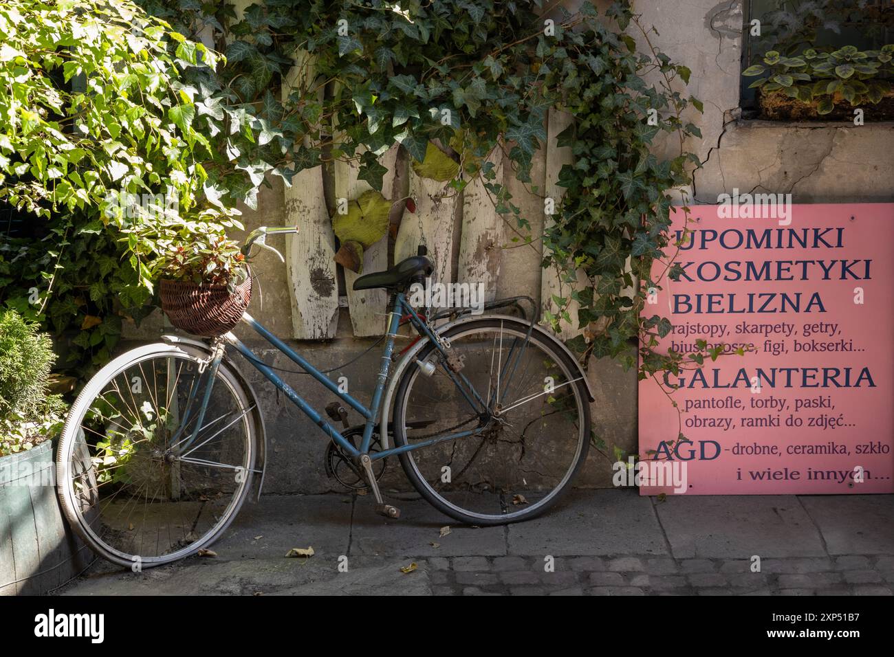 Charming Krakow street detail in Kazimierz featuring an old blue bike ...