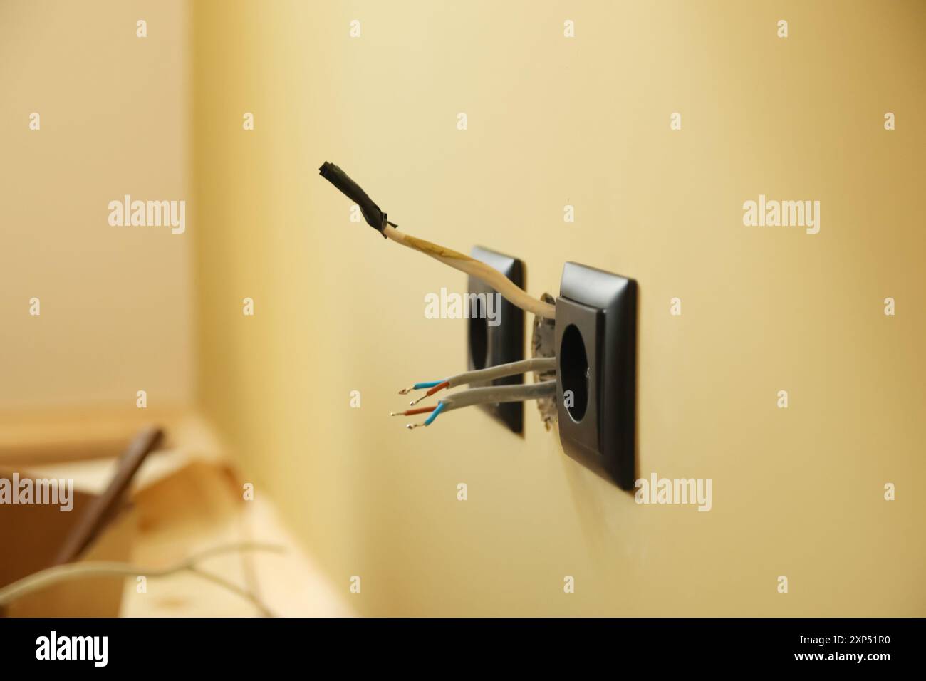 Electrical wiring concept. Black electrical socket with wires and tools ...