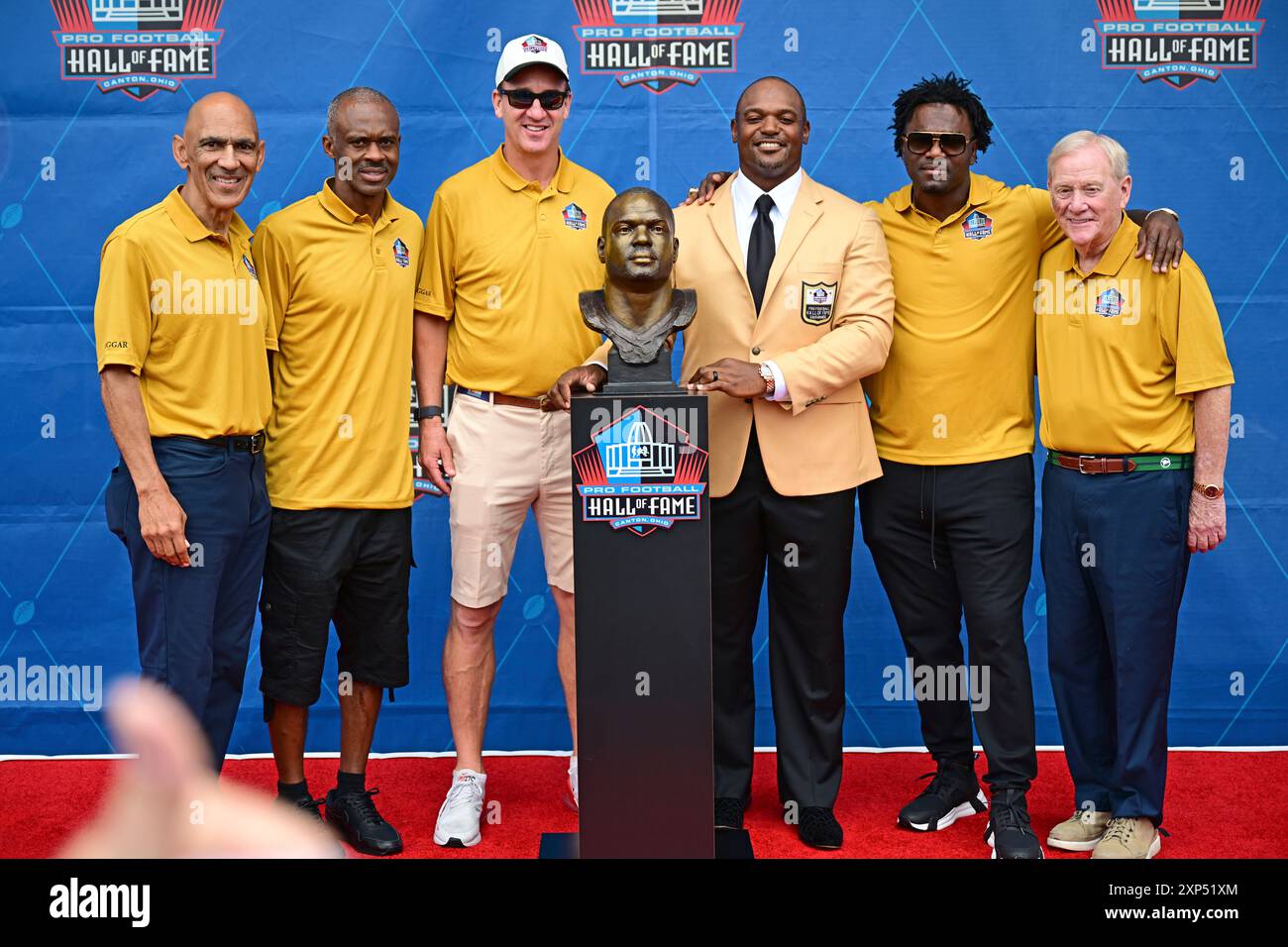 Newly inducted in the Pro Football Hall of Fame, Dwight Freeney, third from right, poses with ...