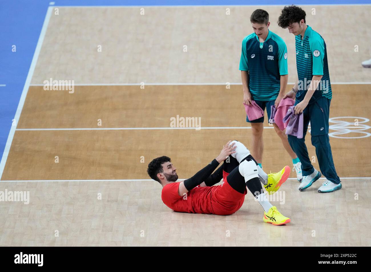 Marcin Janusz of Poland reacts in pain on the court during the Group B ...