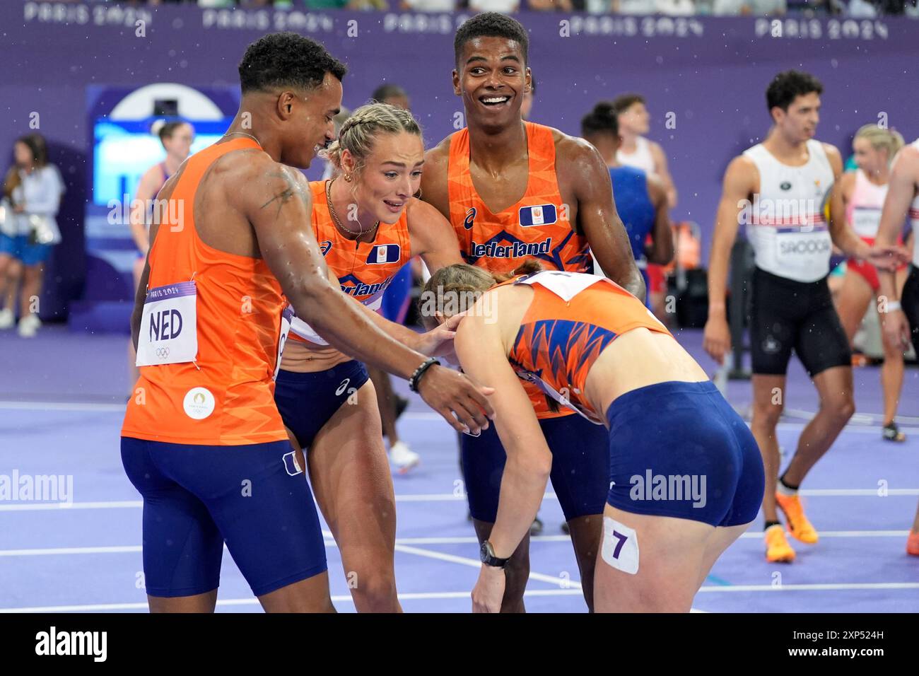 Netherlands team celebrate after winning the 4x400-meter mixed relay ...