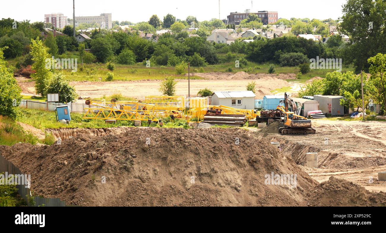Excavator in a construction pit, heavy machinery. Engineering project ...