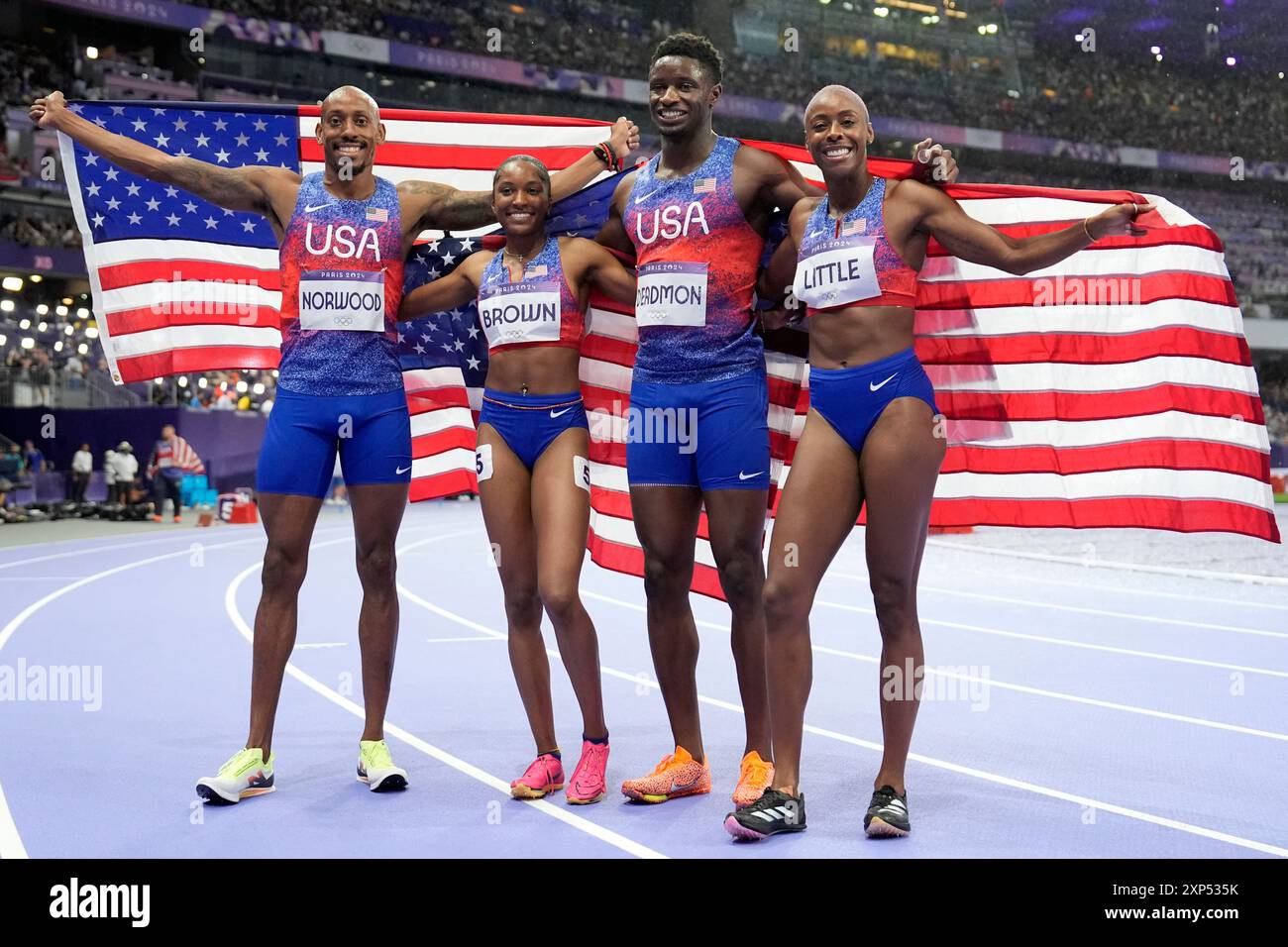 United States runners pose for a photo as they celebrate their silver ...